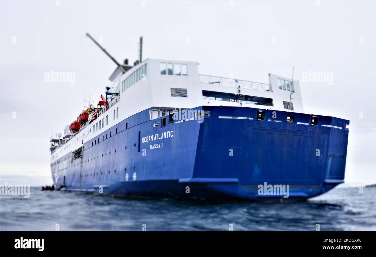 Expedition cruise ship in Antarctica with snow, ice or icebergs behind ...