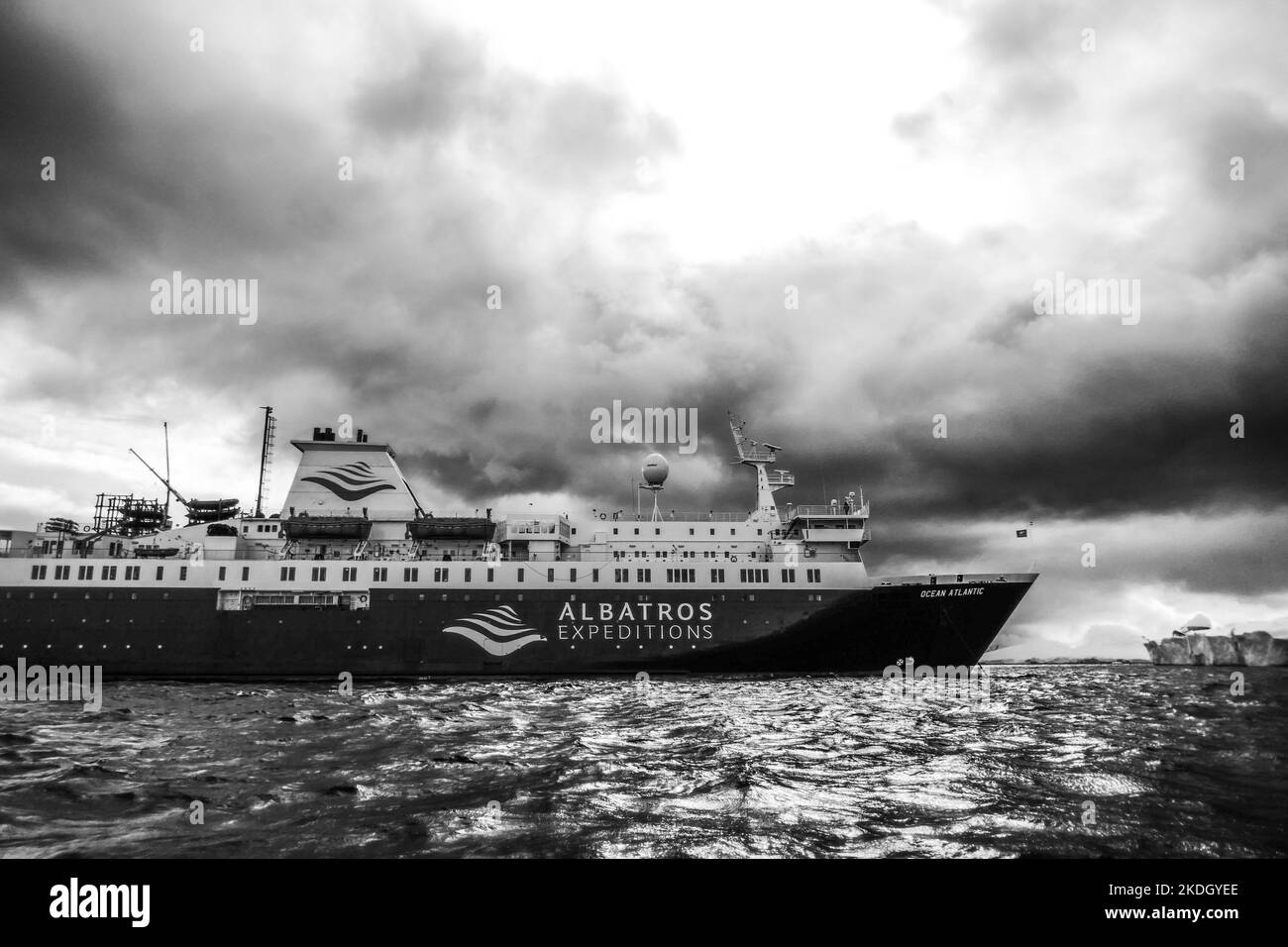 Expedition cruise ship in Antarctica with snow, ice or icebergs behind ...