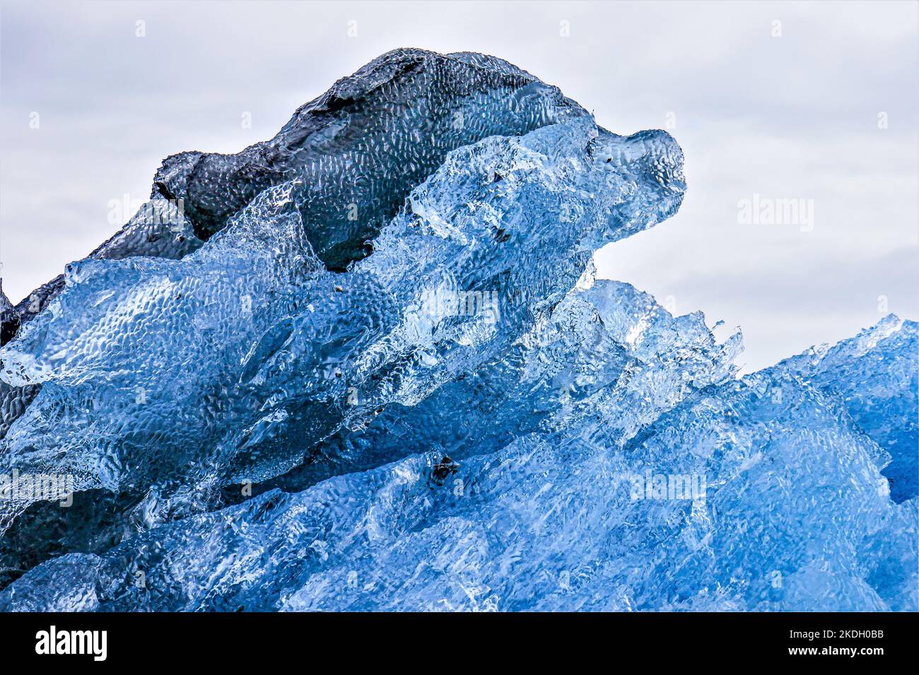 An iceberg of blue ice in Antarctica with an interesting hole / arch ...