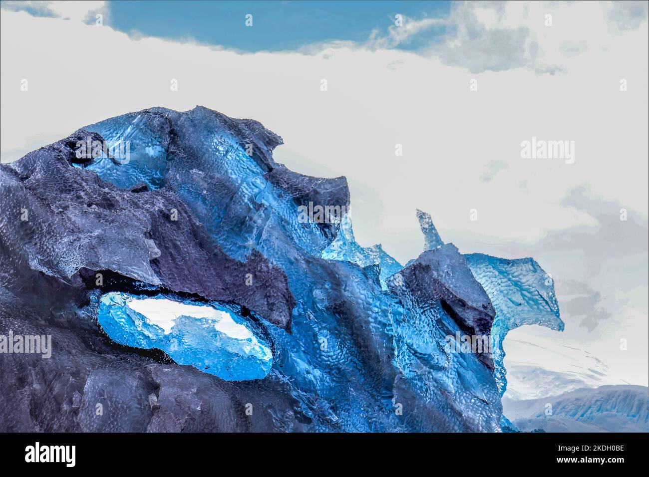 An iceberg of blue ice in Antarctica with an interesting hole / arch ...