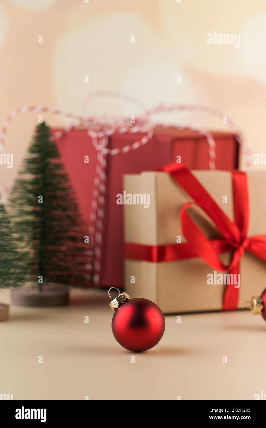 Christmas tree toy on the background of gift boxes. New Year's card ...