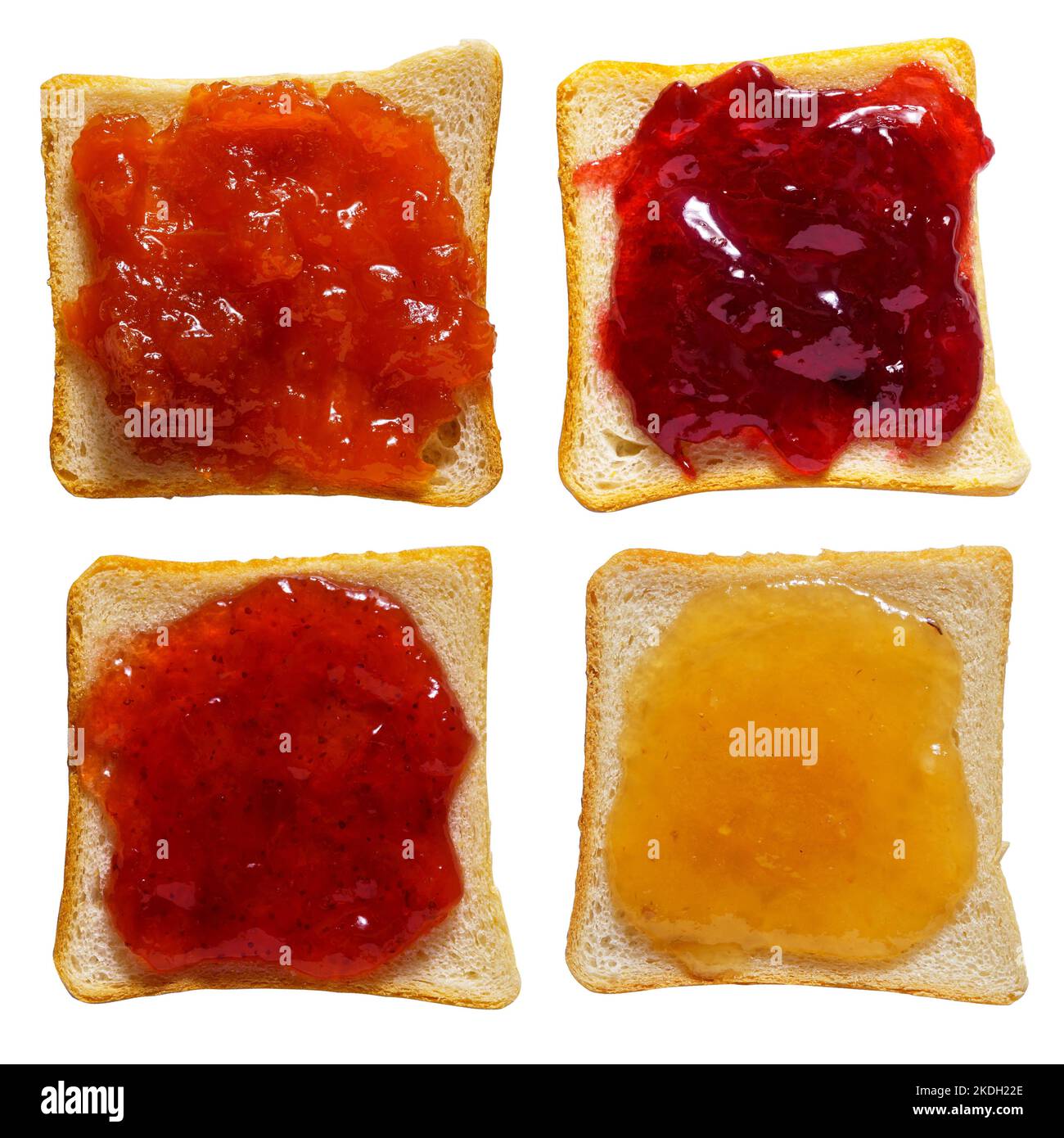 Four toasted bread with different jams isolated Stock Photo - Alamy