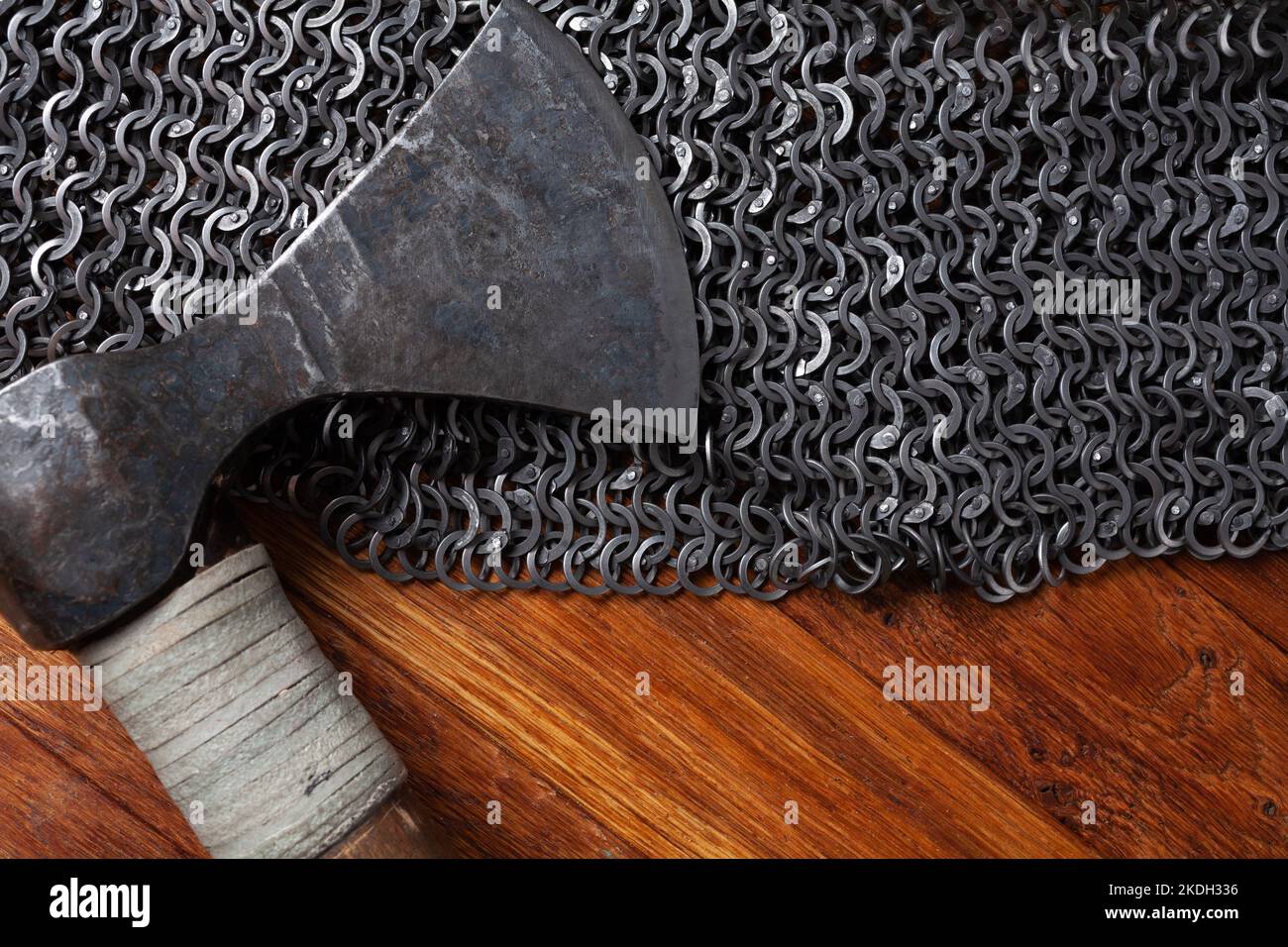 battle axe on chain mail armor background Stock Photo - Alamy