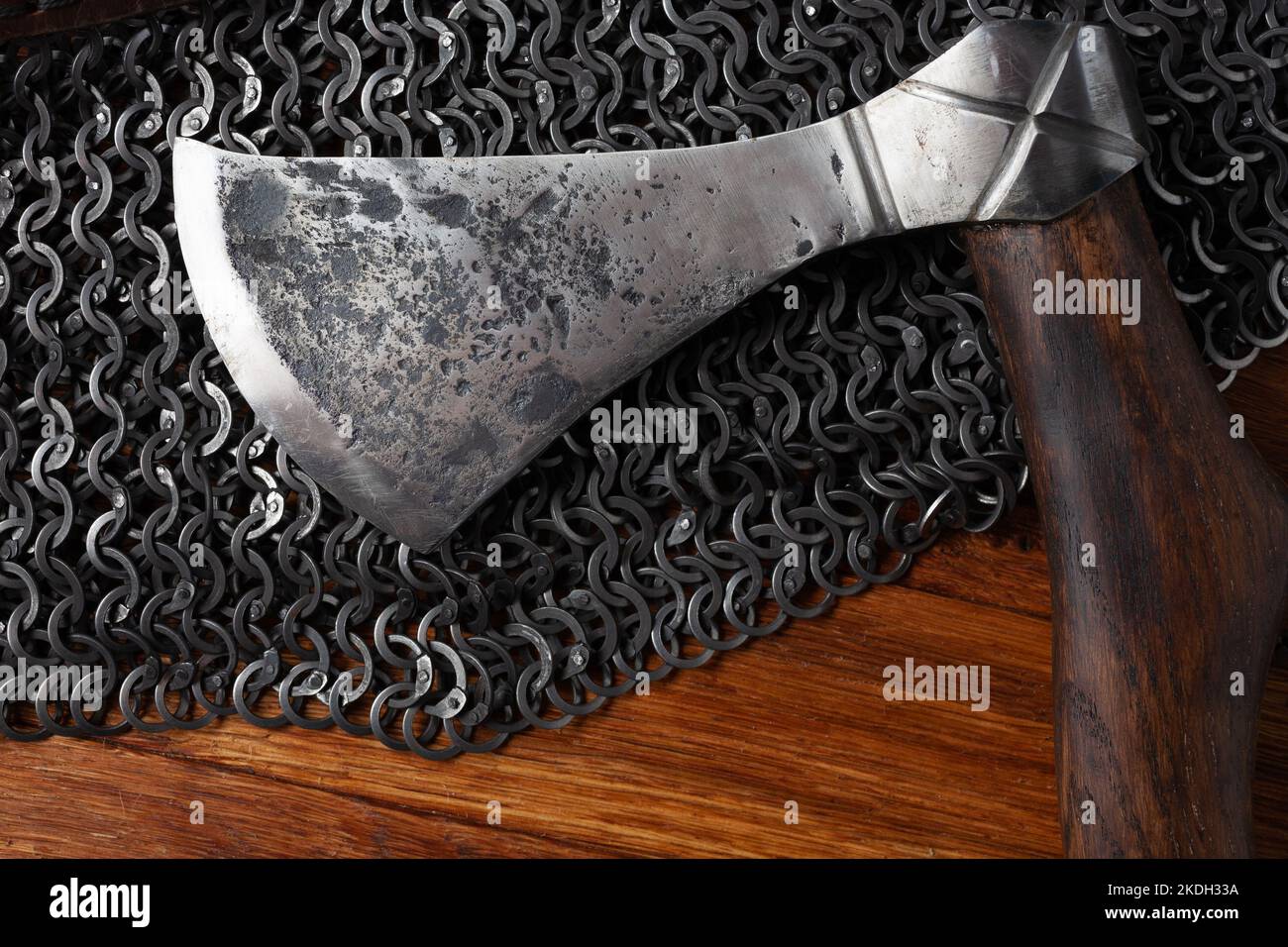 battle axe on chain mail armor background Stock Photo - Alamy