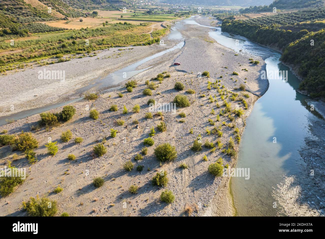 Aerial view of river Osumi by village Mbrakull near Polican in Albania ...