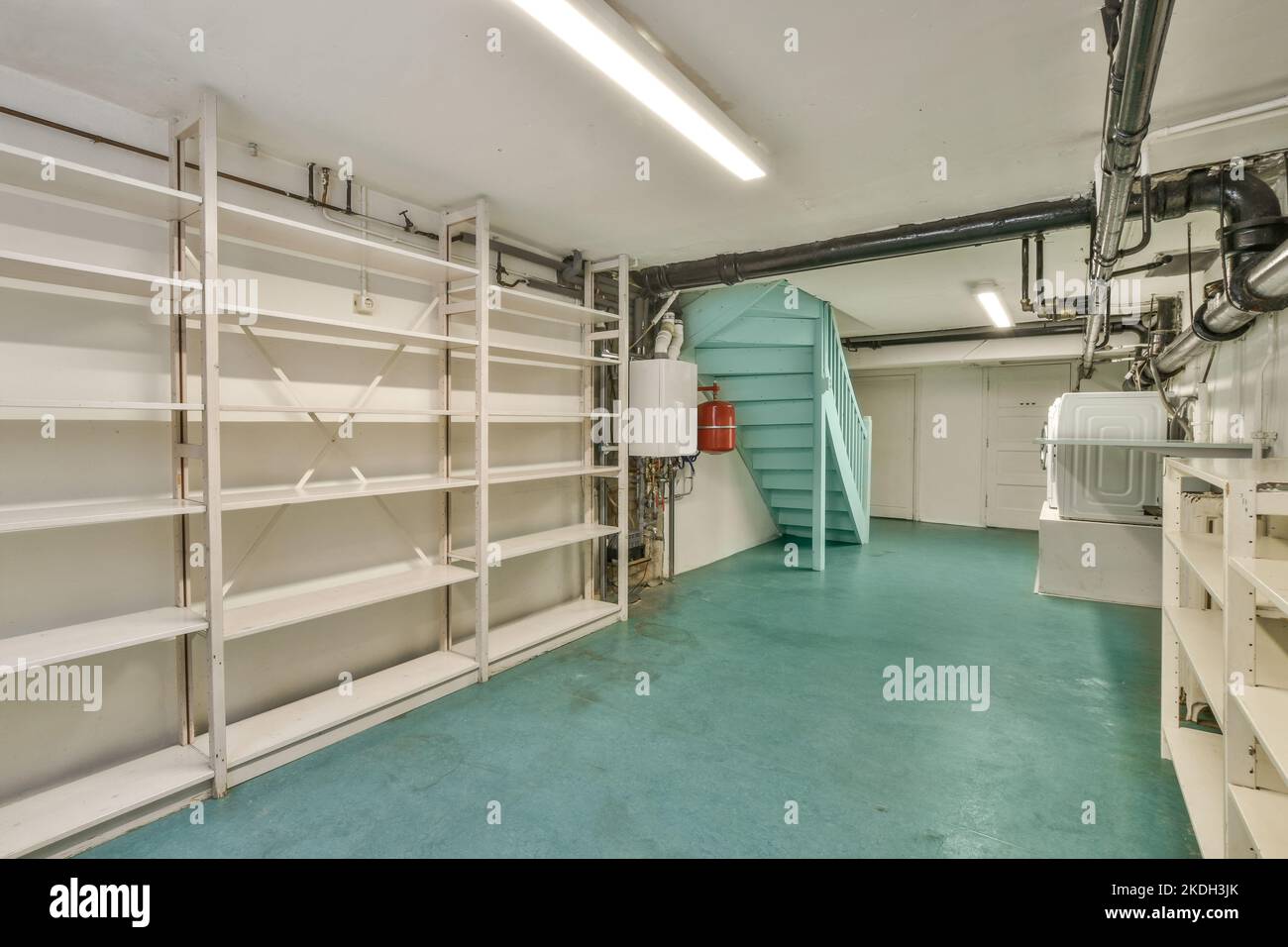 Boiler room of an apartment building with pipes and metering devices. A ...