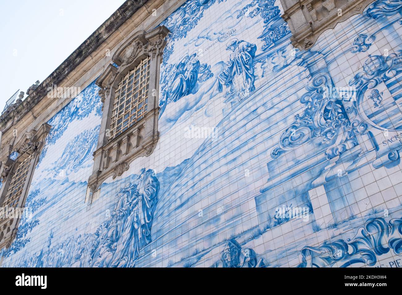 Blue brick tiled painting on a church wall landmark in Porto Stock ...