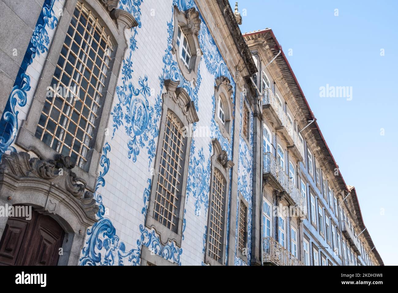 Blue brick tiled painting on a church wall landmark in Porto Stock ...