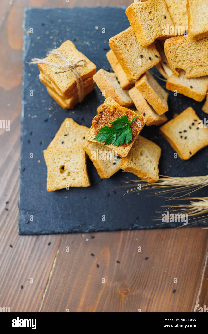 Fresh croutons made of whole grain flour, golden in color. Toasts for ...