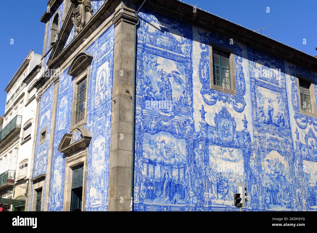 Blue brick tiled painting on a church wall landmark in Porto Stock ...