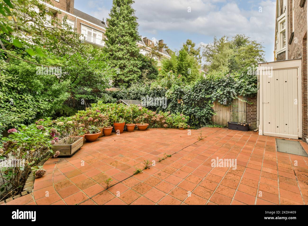Simple small patio with small garden Stock Photo - Alamy