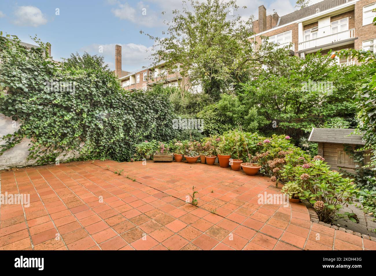 Simple small patio with small garden Stock Photo - Alamy
