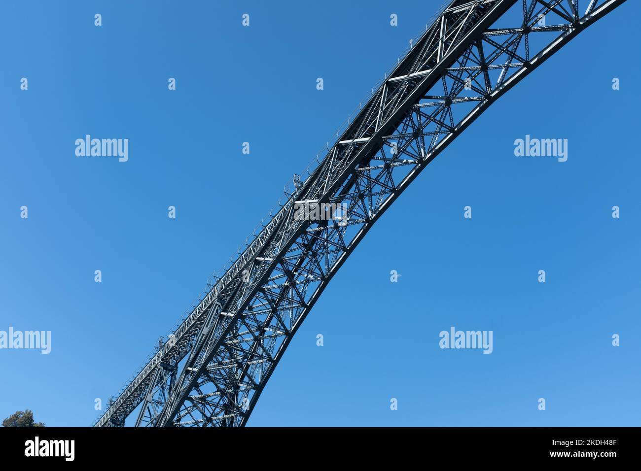 Dom Luis iron bridge structure detail seen from the bottom on a blue ...