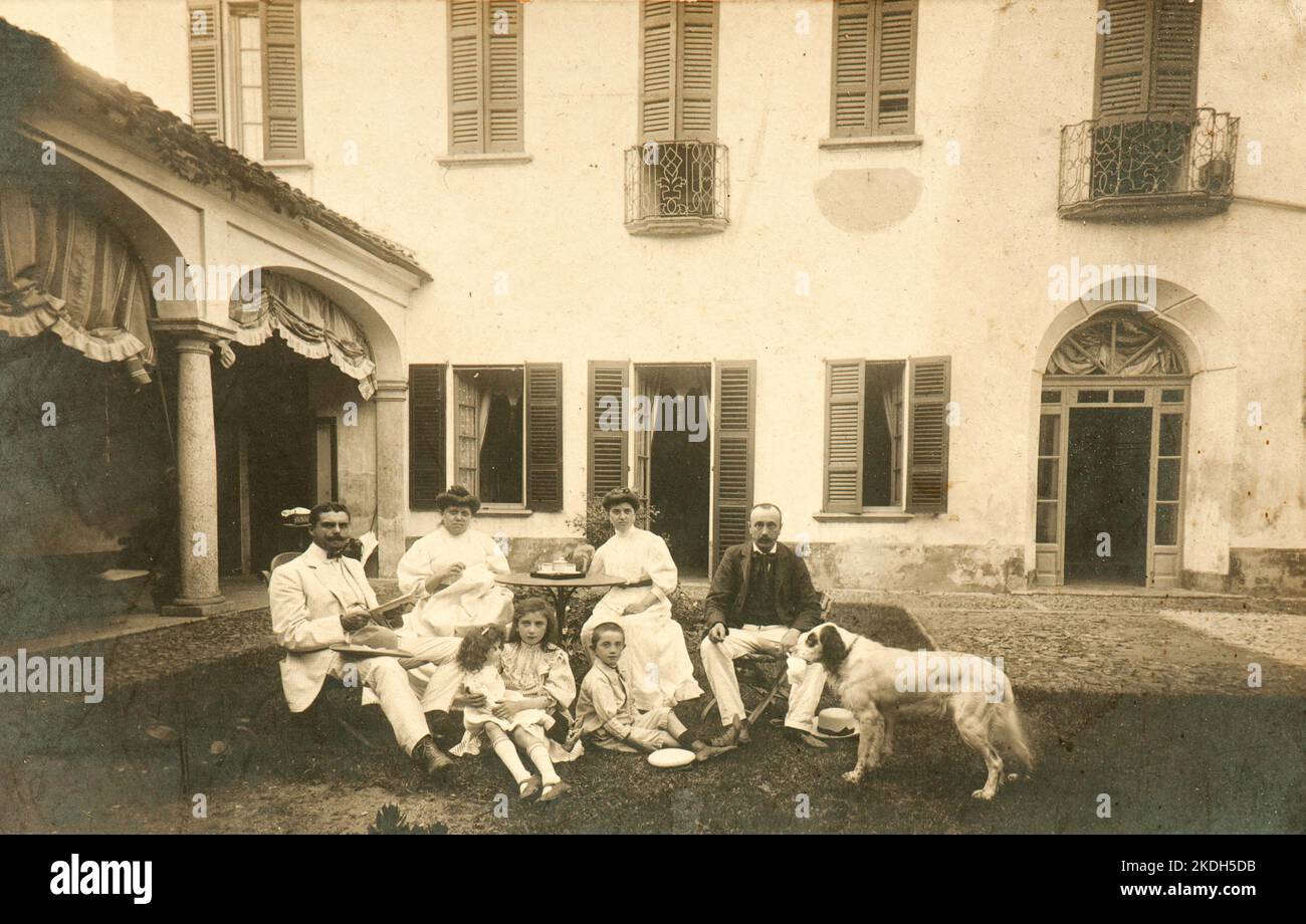 A rich Italian family poses for a photo in the yard of their beautiful ...