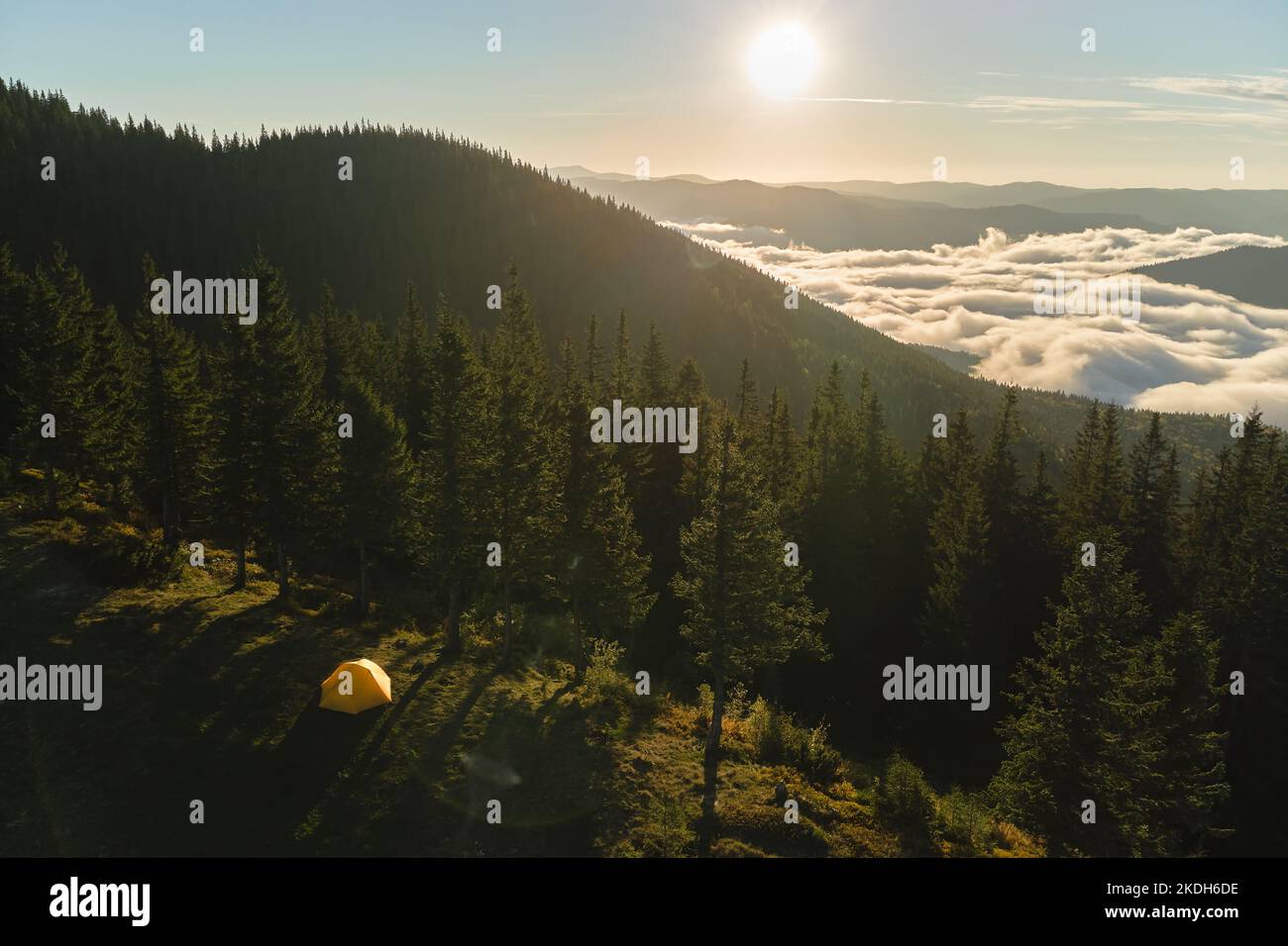 Aerial view of tourist camping tent on mountain campsite at bright ...