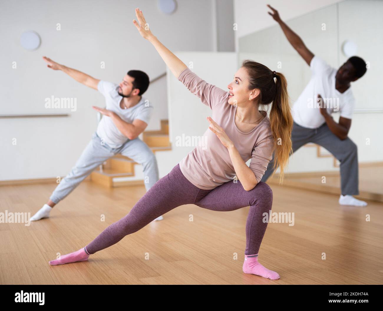 Cheerful woman dancing aerobic dance during group training Stock Photo ...