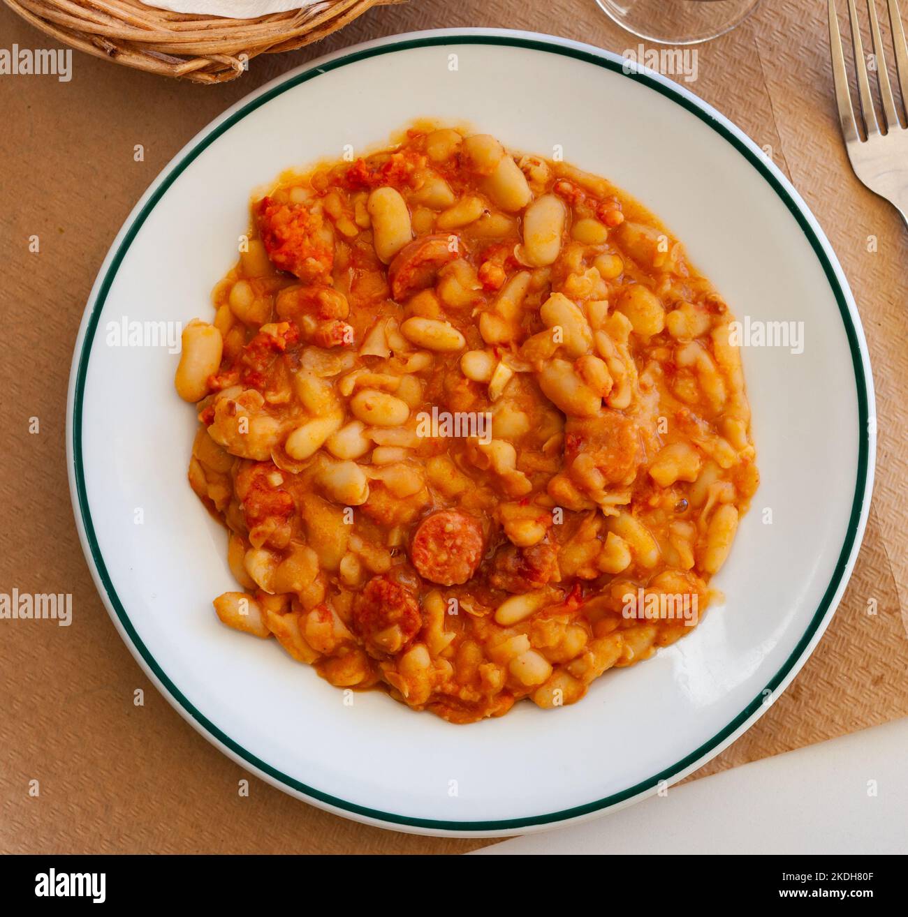 Appetizing braised beans with chorizo sausage pieces Stock Photo - Alamy