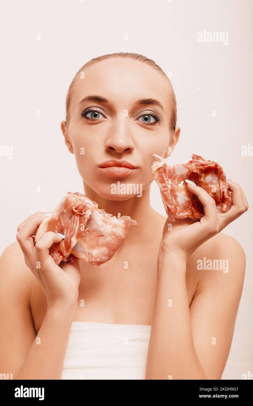 Young woman eating raw meat hi-res stock photography and images - Alamy