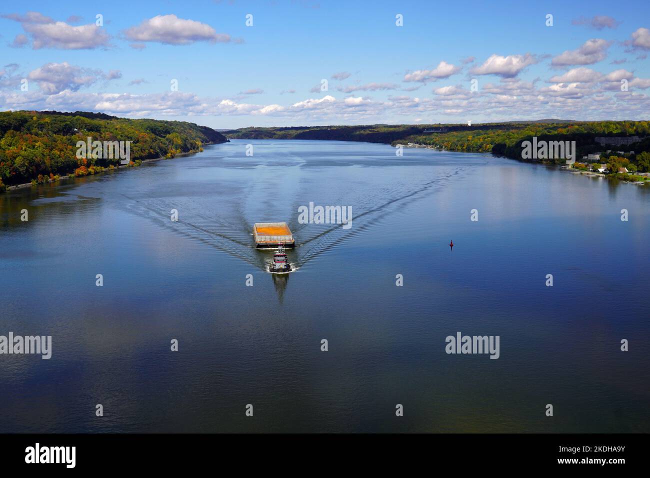 Tug boat pulling an empty barge on the Hudson River in NY Stock Photo ...