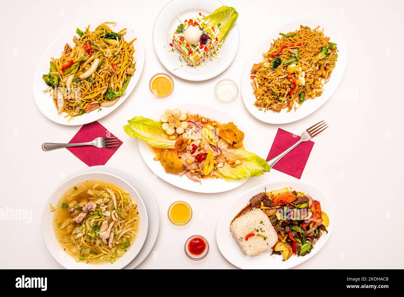 Set of Peruvian food dishes with a corvina ceviche in the center, soup ...