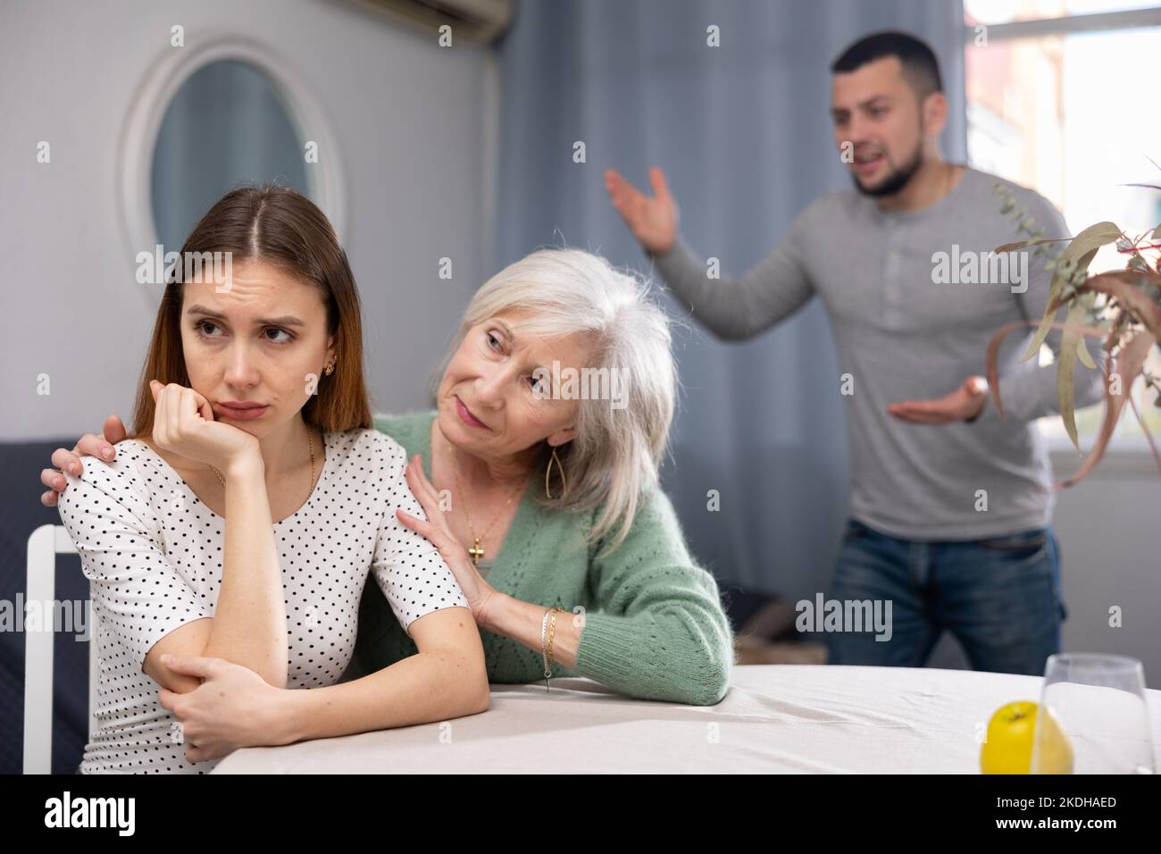 Quarrel Between Husband And Wife Senior Mother Comforting Adult