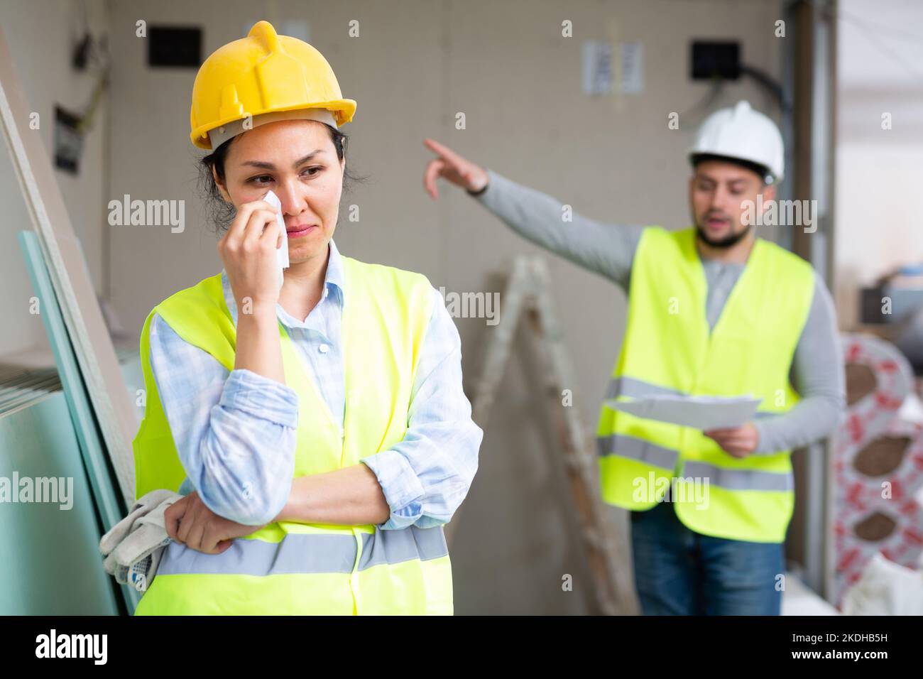 Woman engineer crying because she has been fired by her foreman Stock ...