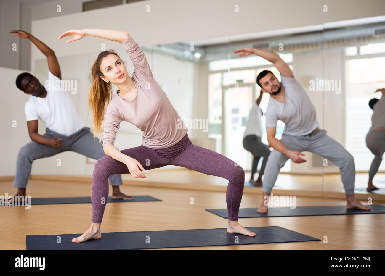 Woman performing stretching exercise during hi-res stock photography ...