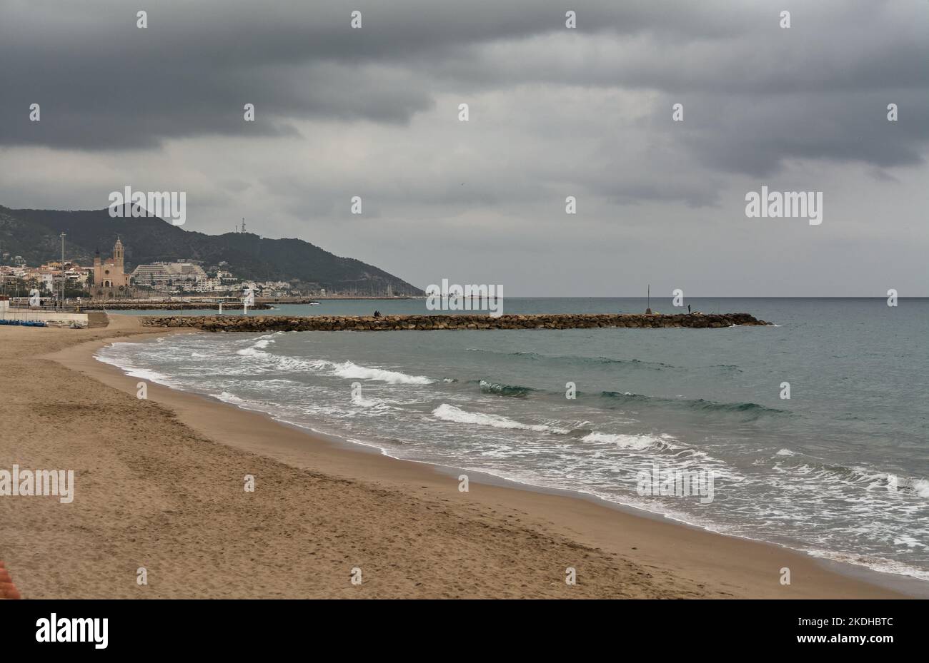 Empty beach Sitges, Catalunya ,Spain in winter with the overcast sky ...