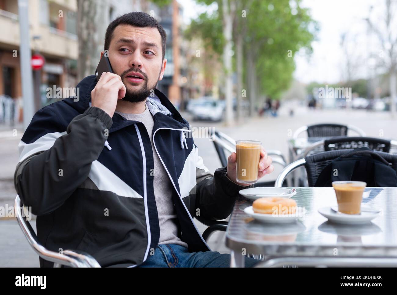 Portrait of european male traveler relaxing in street cafe Stock Photo ...