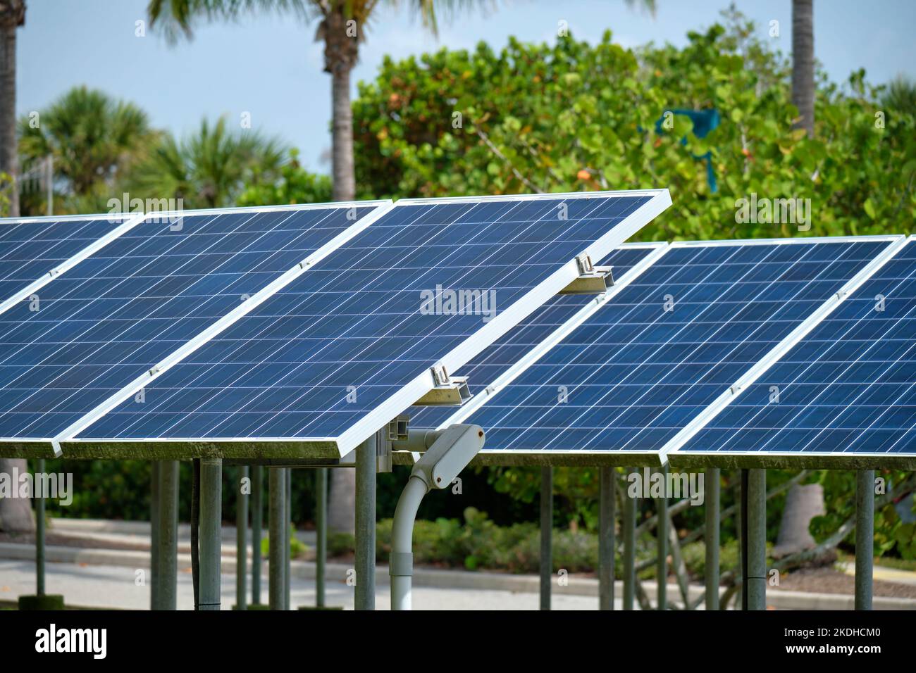 Solar panels installed on stand frame near parking lot for effective ...