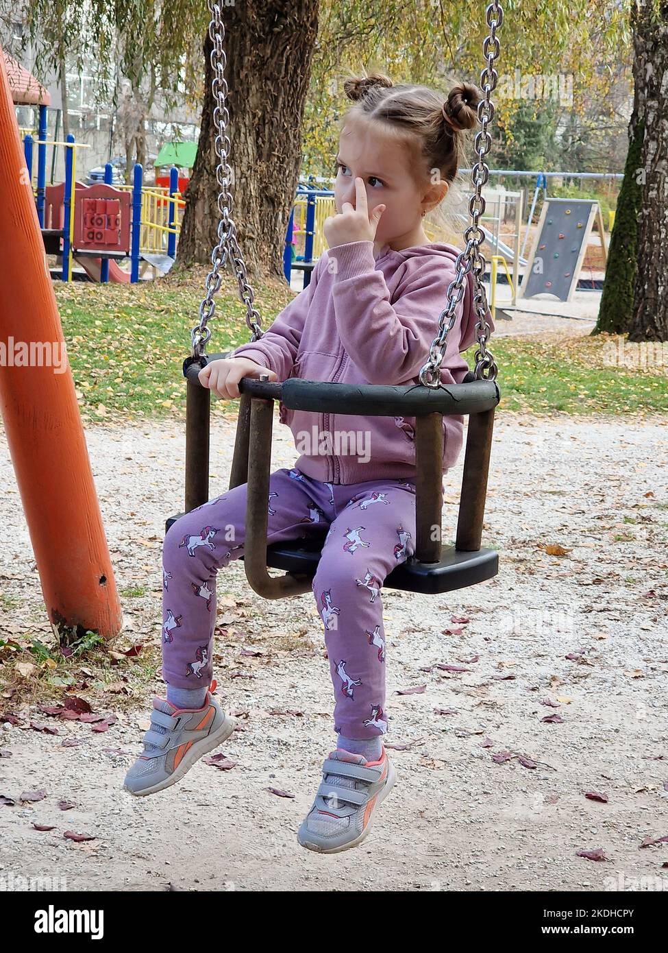 Happy little girl on a swing in the park. Child on playground. Swing Kid play outdoor Stock ...