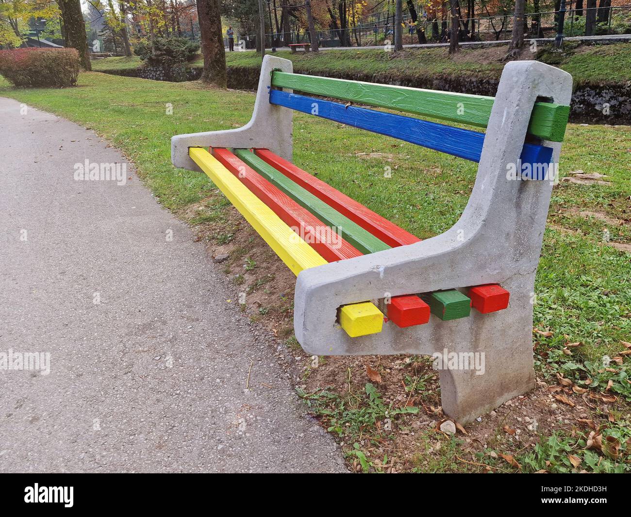 Creative colorful street park wooden bench painted in bright colors ...