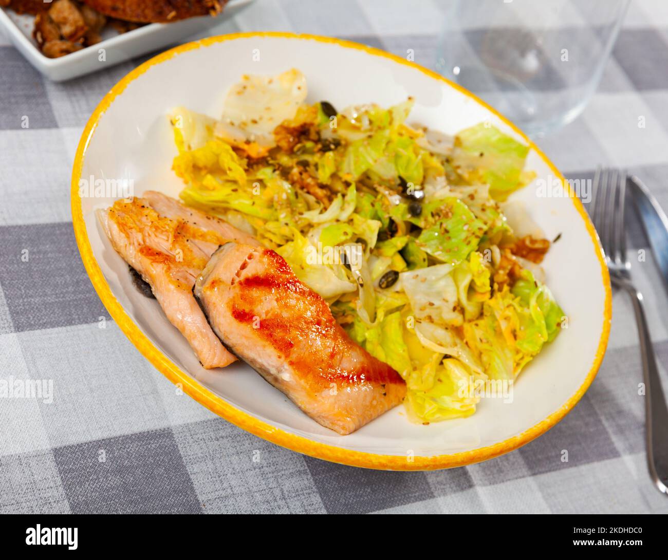 Appetizing salmon with a vegetable salad Stock Photo - Alamy