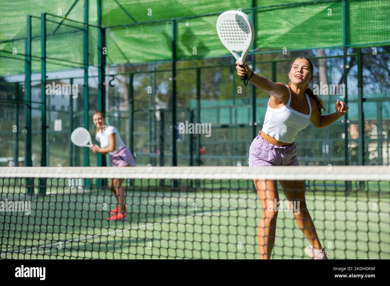Two women tennis players playing padel Stock Photo - Alamy