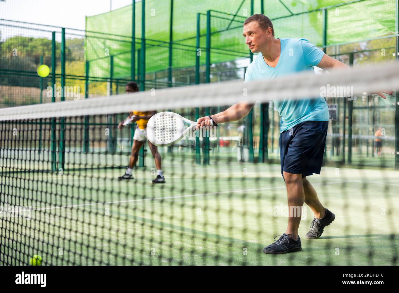 European man padel tennis player trains on the court Stock Photo - Alamy