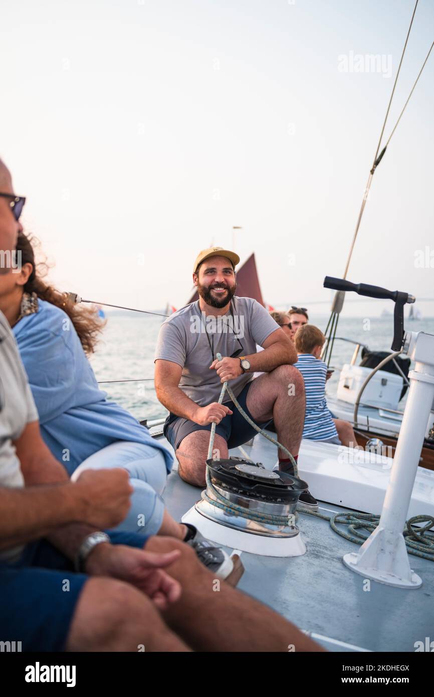 Crew Dan Guedes working aboard Newport sailing charter Heritage Stock Photo - Alamy