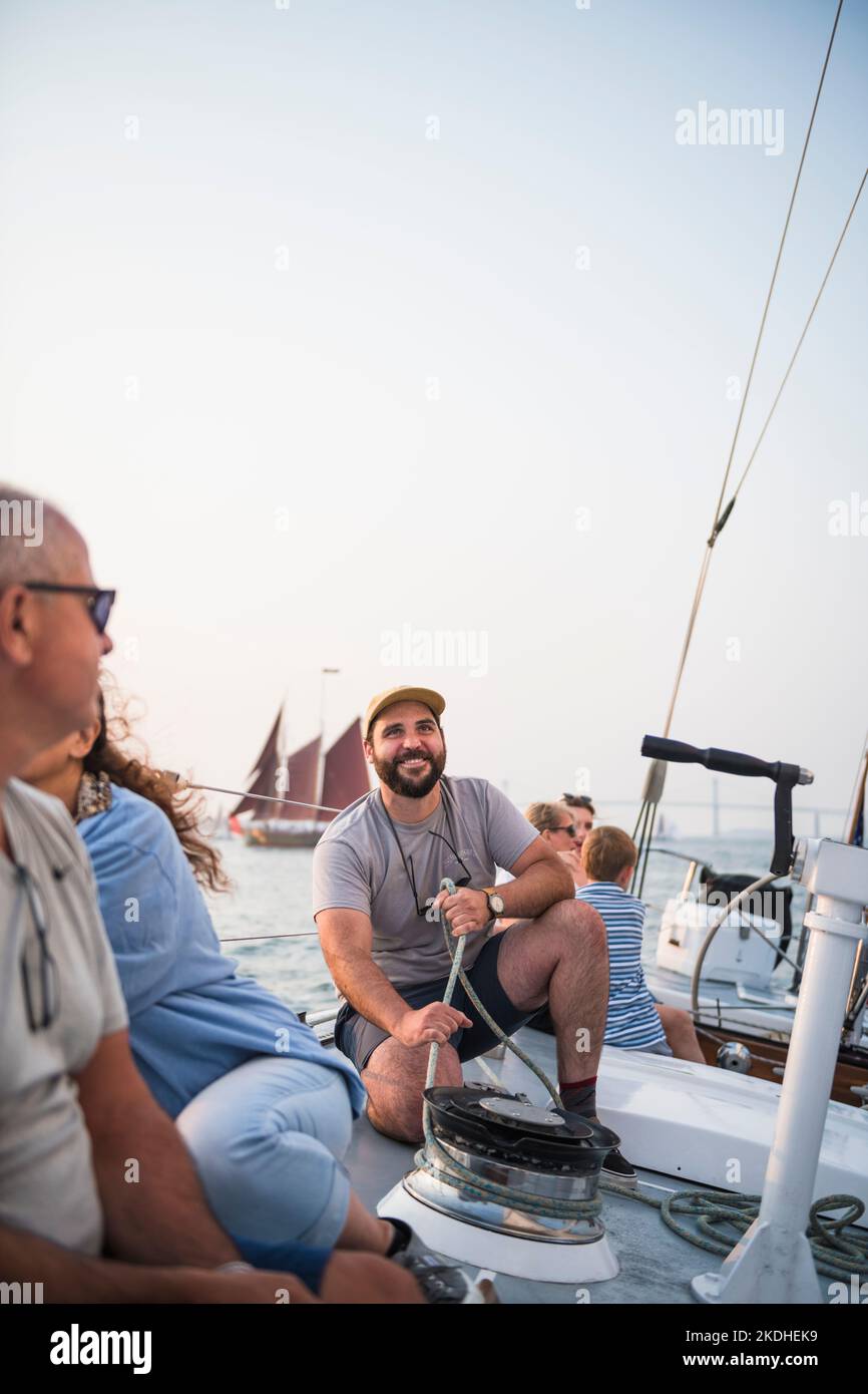 Crew Dan Guedes working aboard Newport sailing charter Heritage Stock Photo - Alamy