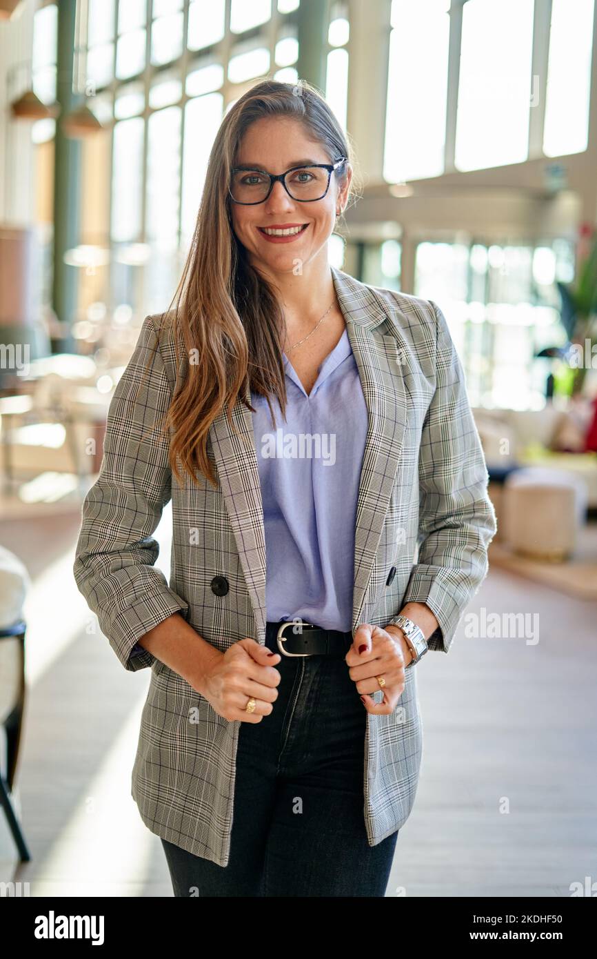The smiling bank manager with a big smile in a big building Stock Photo ...