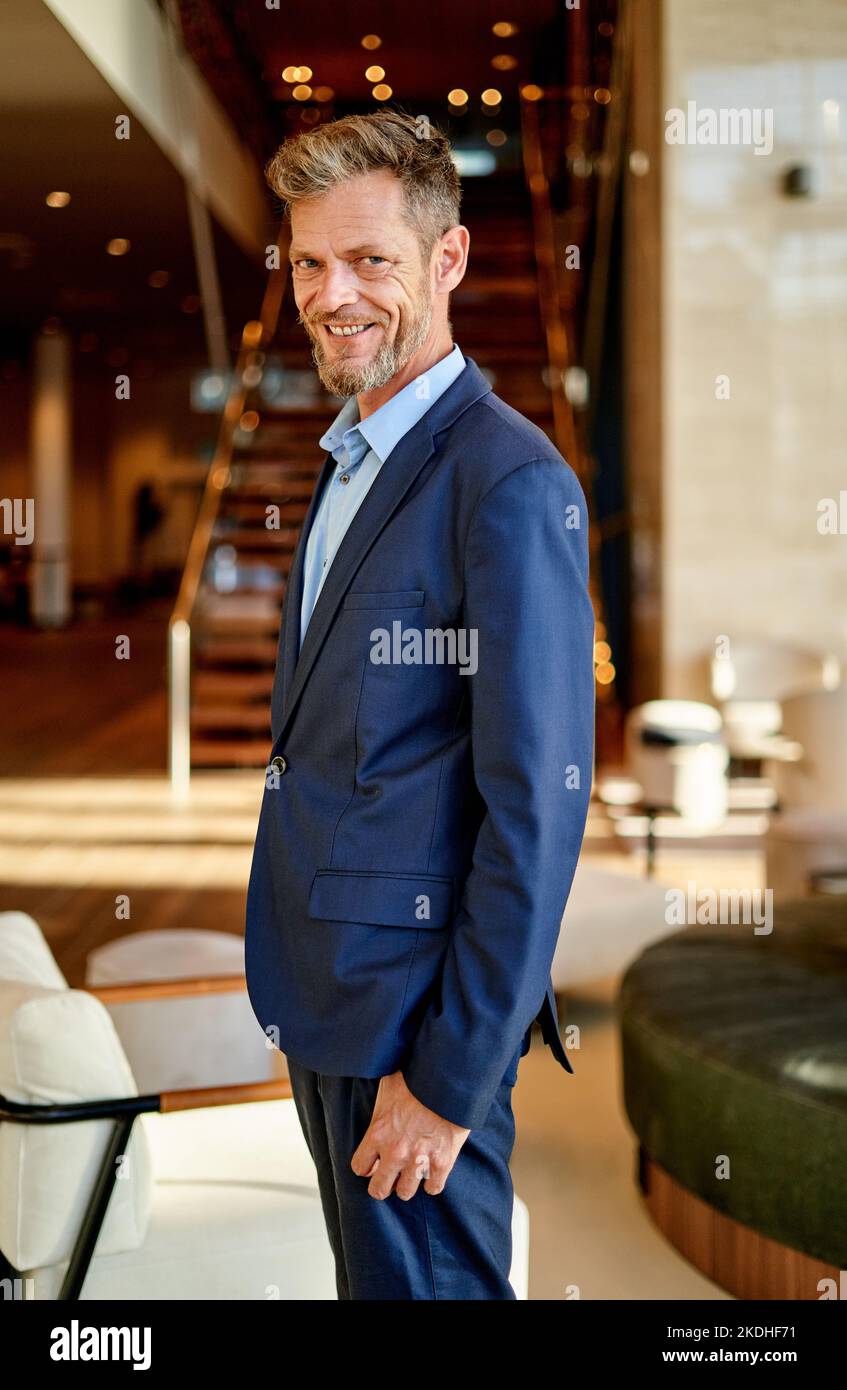 The smiling bank manager with a big smile in a big building Stock Photo ...