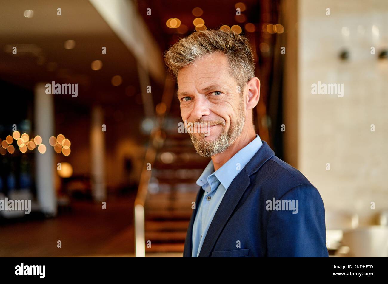 The smiling bank manager with a big smile in a big building Stock Photo ...