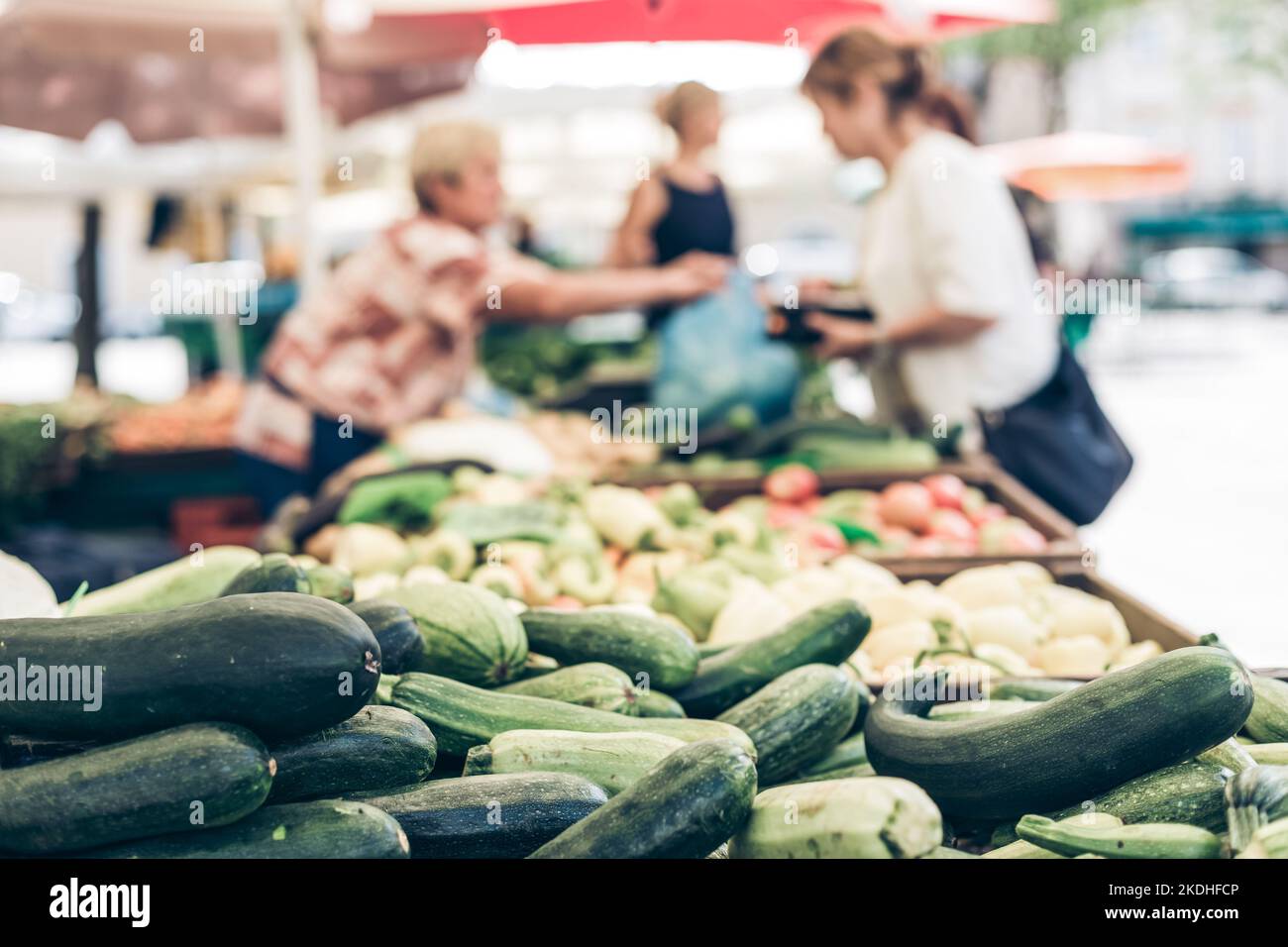 Farmers' food market stall with variety of organic vegetable. Vendor ...