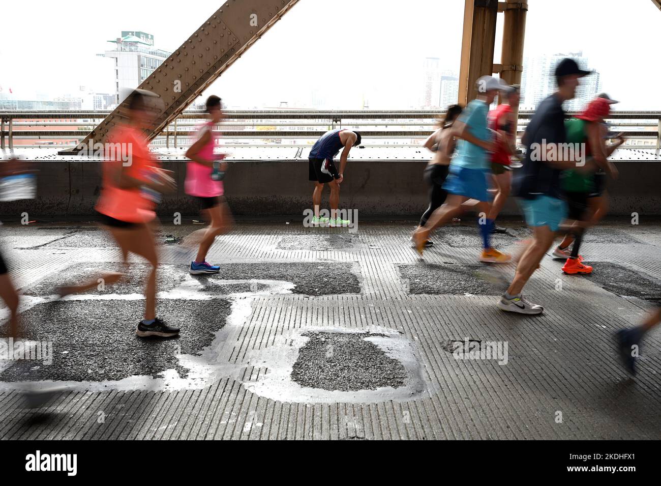 A runner stops along the 59th Street bridge during the 2022 TCS New ...