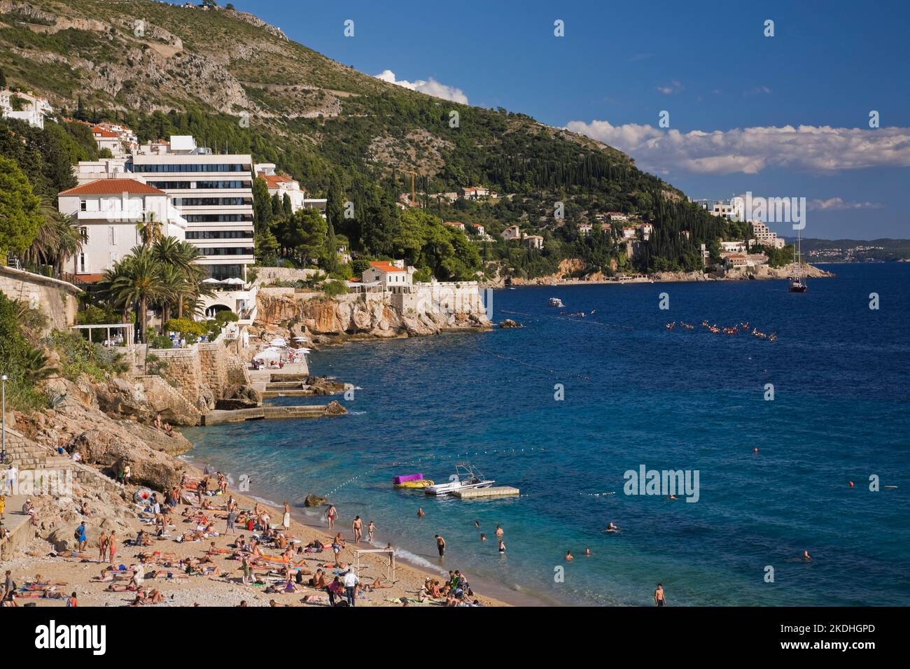 Sunbathers on the beach facing the Adriatic ocean, Dubrovnik, Dalmatia ...