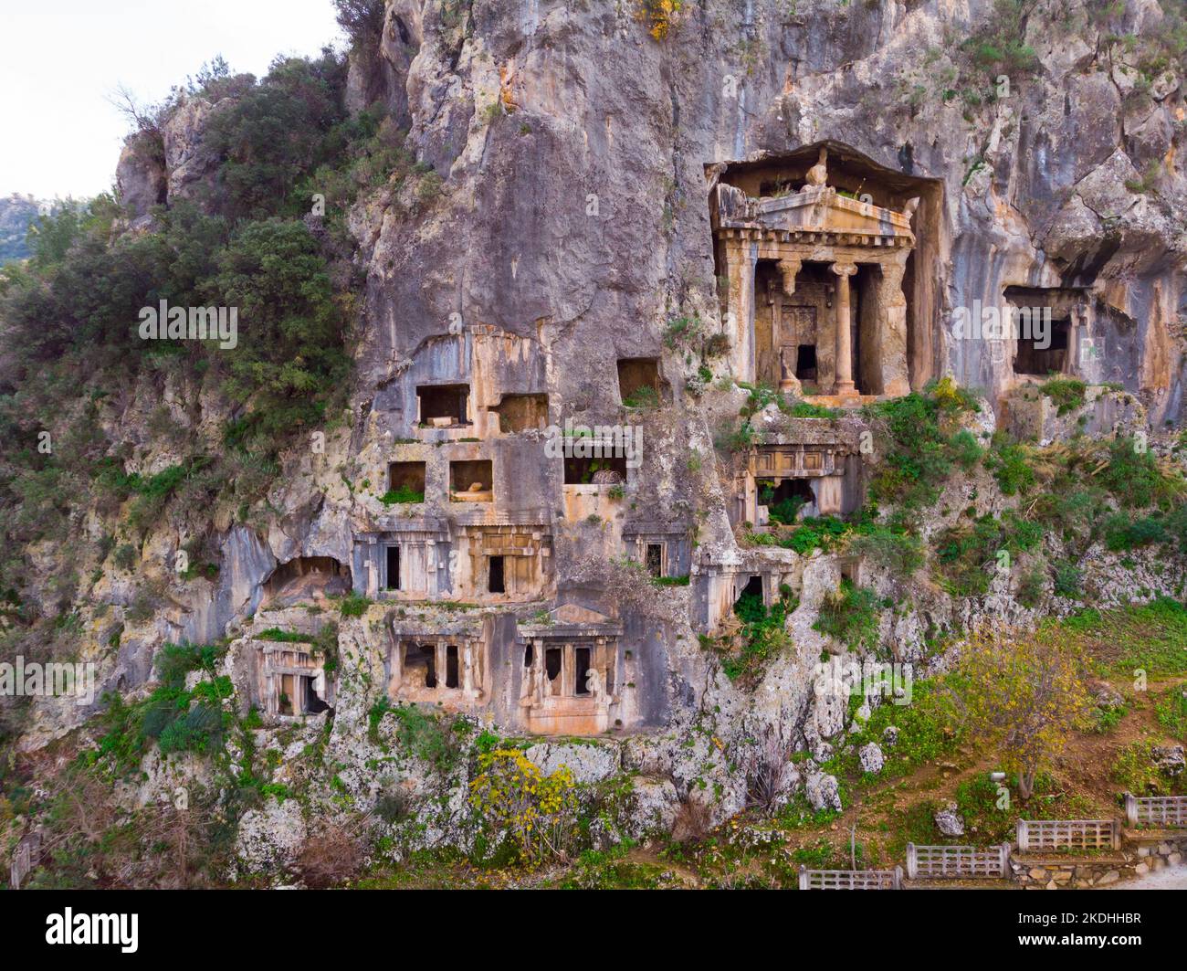 Antique rock burial chambers in Turkish village of Fethiye Stock Photo ...