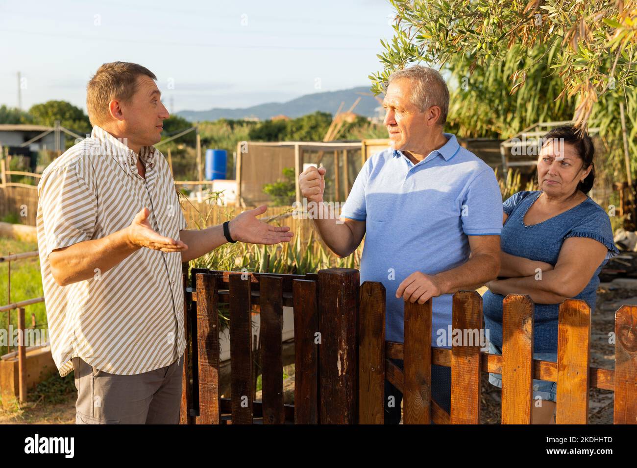 Unhappy male neighbor standing hi-res stock photography and images - Alamy