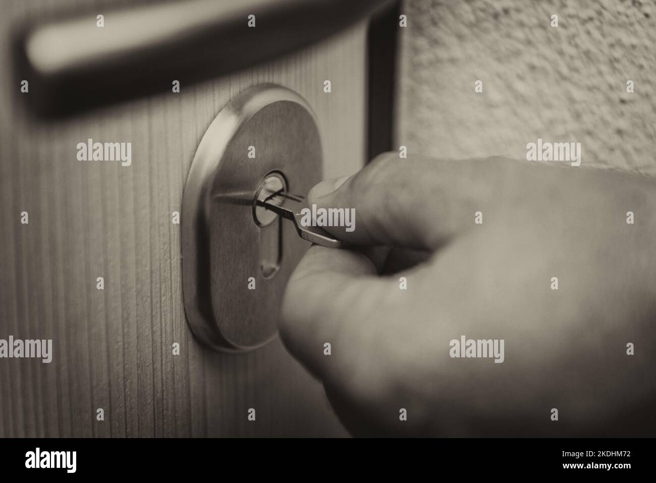 Locking Up or Unlocking Door With Key With Hand Stock Photo - Alamy