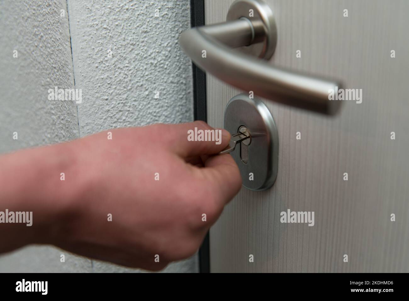 Locking Up or Unlocking Door With Key With Hand Stock Photo - Alamy