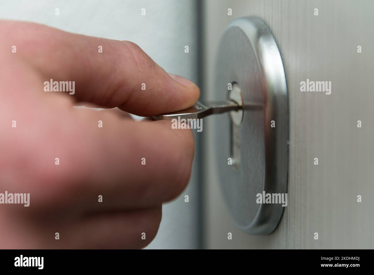 Locking Up or Unlocking Door With Key With Hand Stock Photo - Alamy