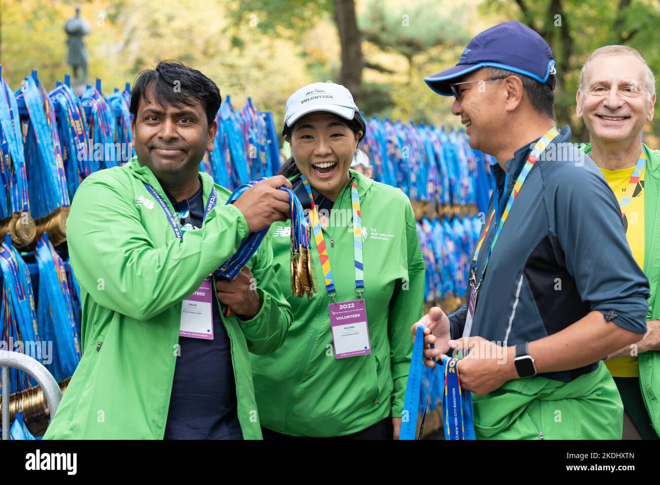 Volunteers help to finishers of 51st TCS NYC marathon with their medals ...