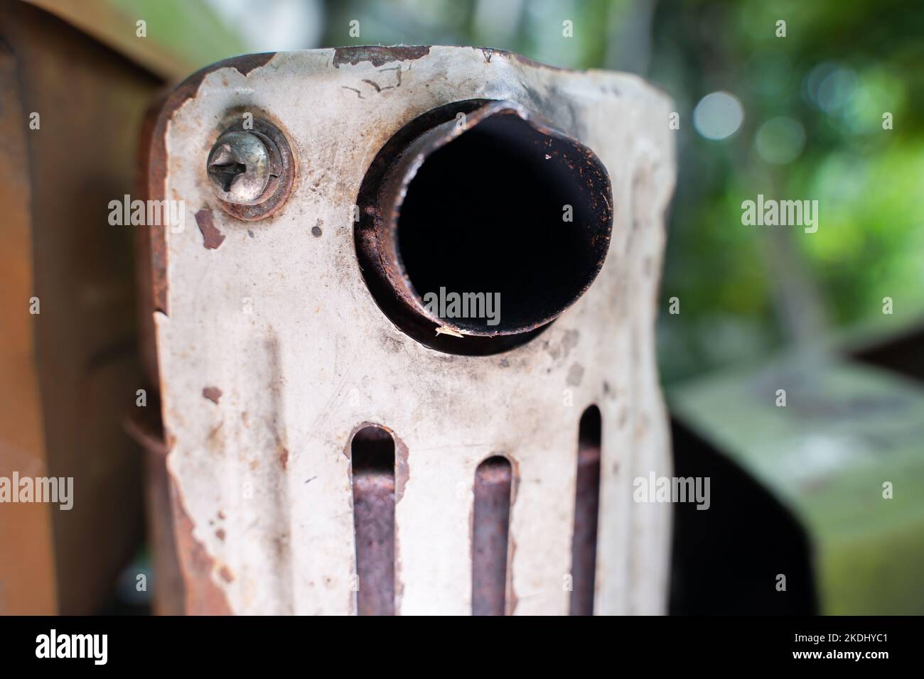 Exhaust pipe of a walk-behind tractor close-up on a blurred background ...